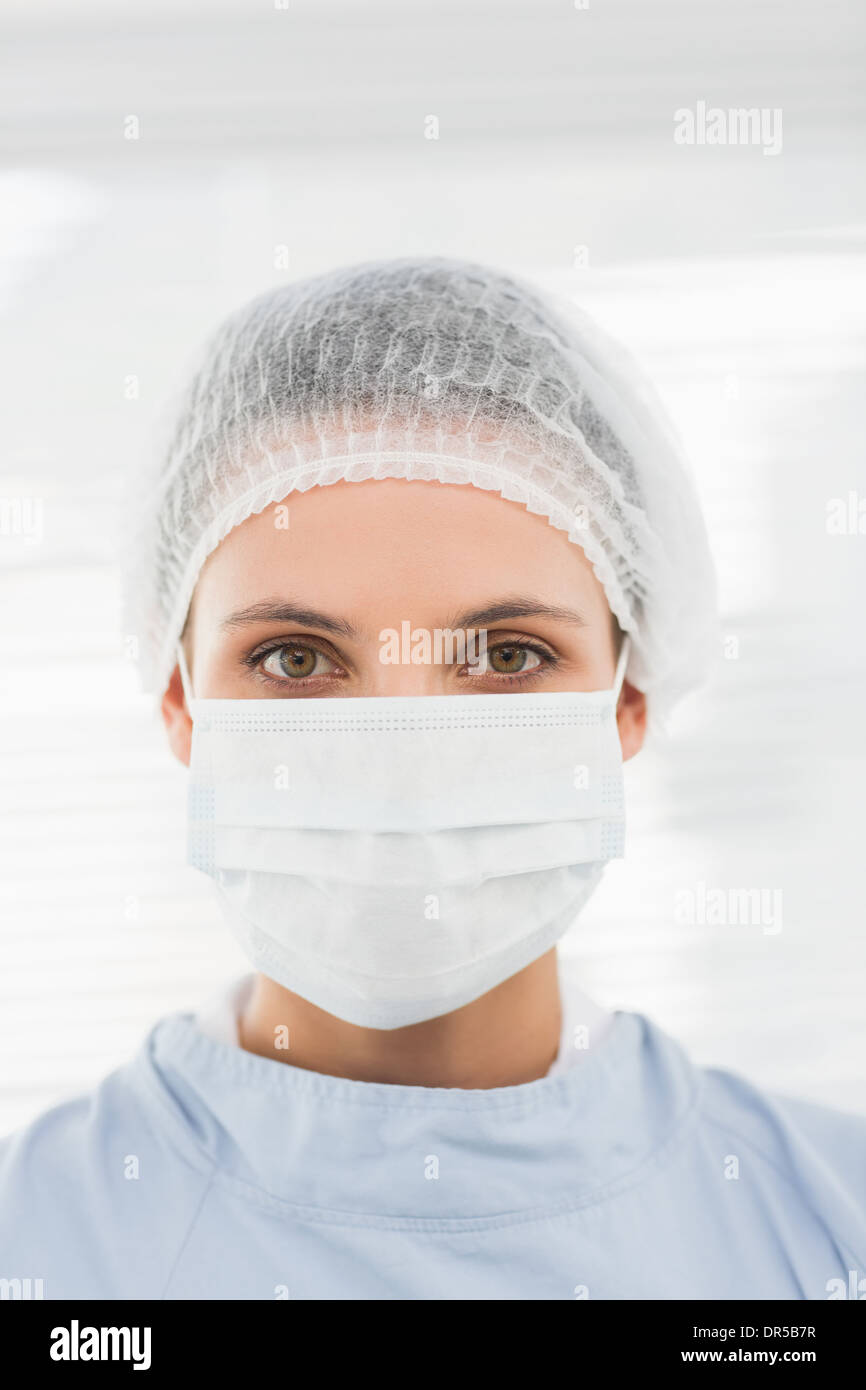 Female surgeon wearing surgical cap and mask Stock Photo - Alamy