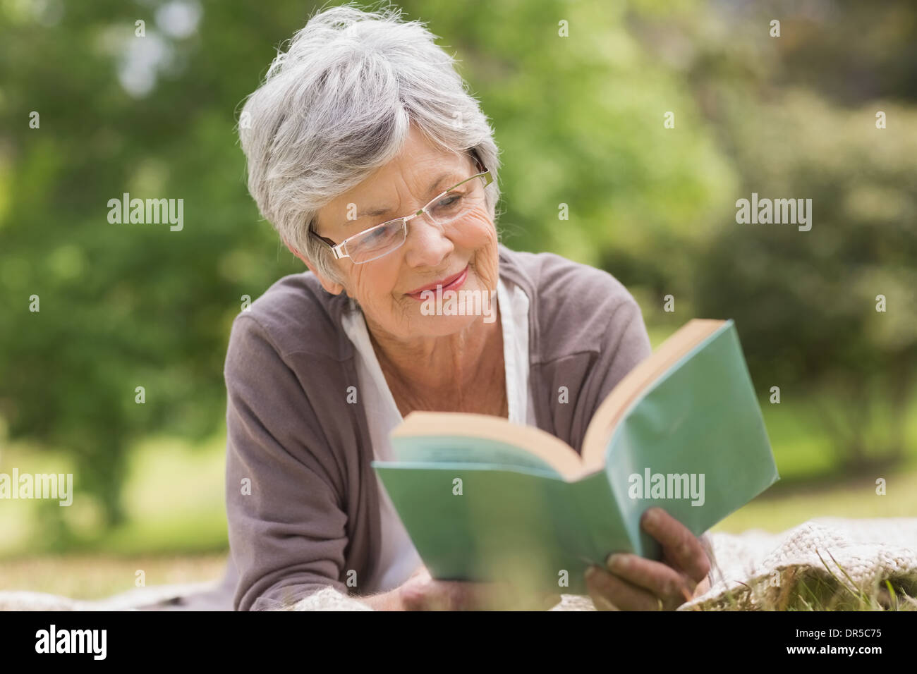 Senior woman pensioner reading hi-res stock photography and images - Alamy