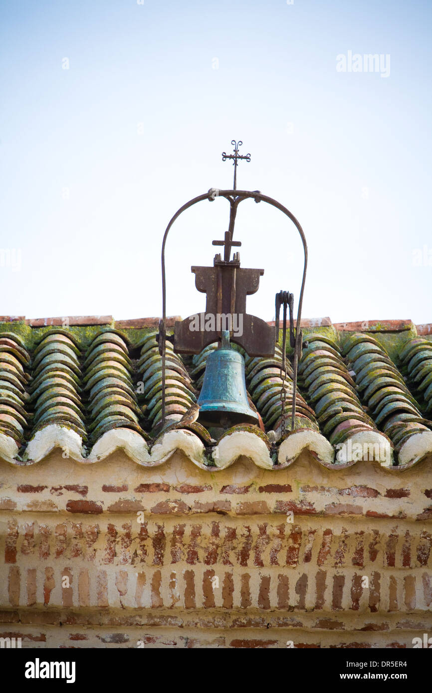 Roof tiles with brass bell Stock Photo - Alamy