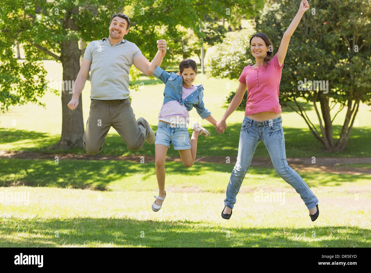 Happy jumping family hi-res stock photography and images - Alamy