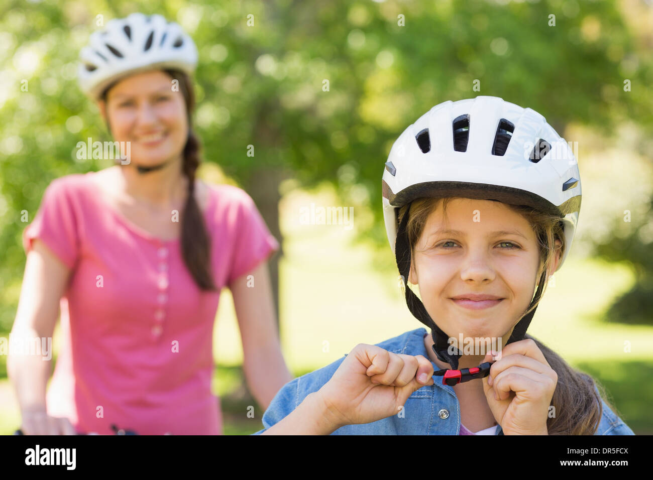 Woman adjusting bicycle hi-res stock photography and images - Alamy