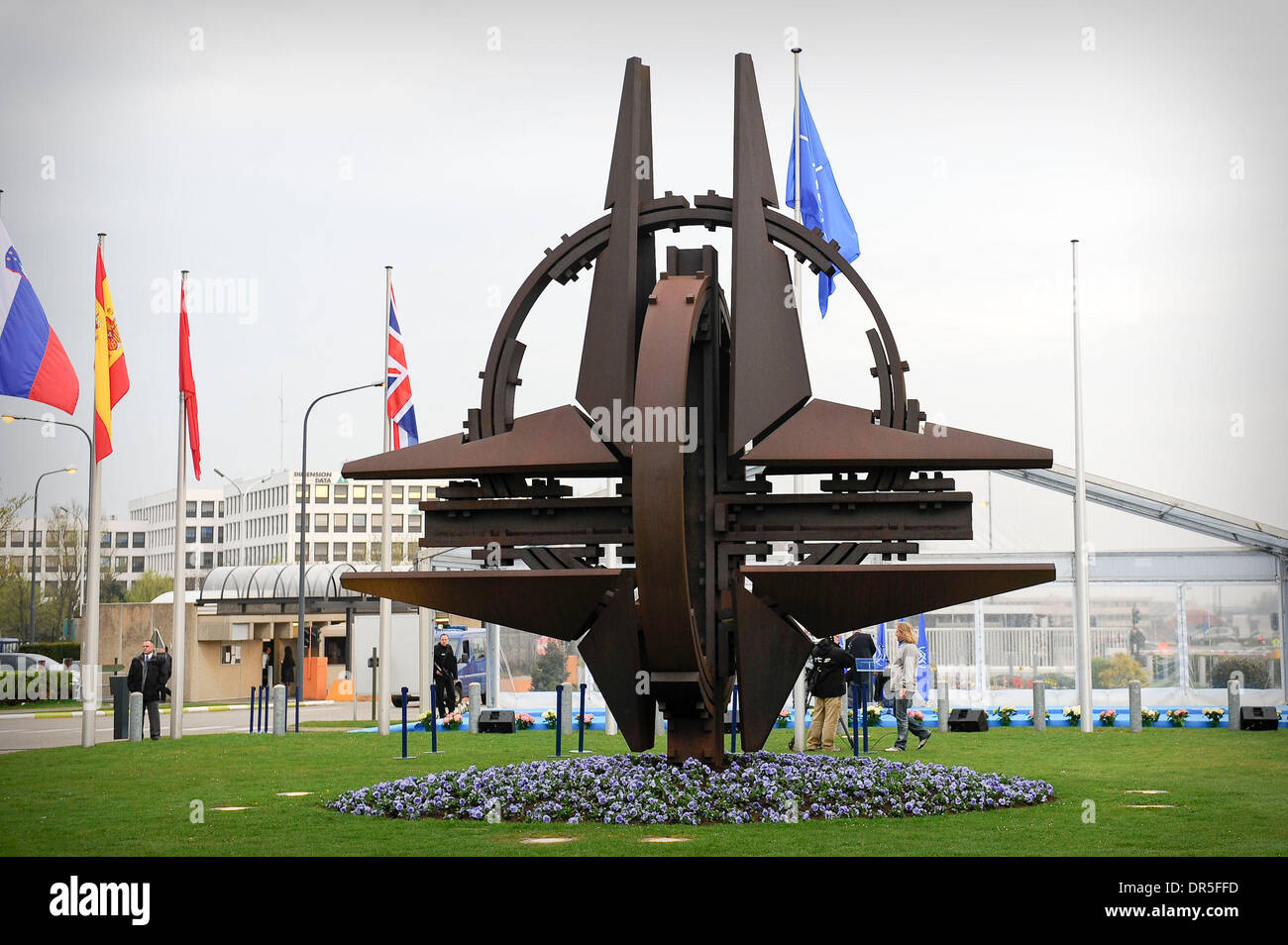 North Atlantic Treaty Organization (NATO) symbol in front of ...