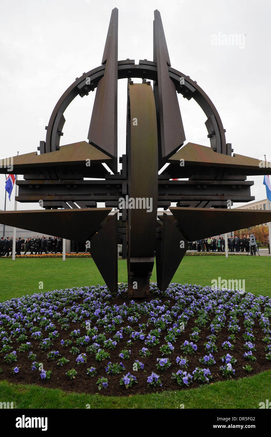 North Atlantic Treaty Organization (NATO) symbol in front of ...