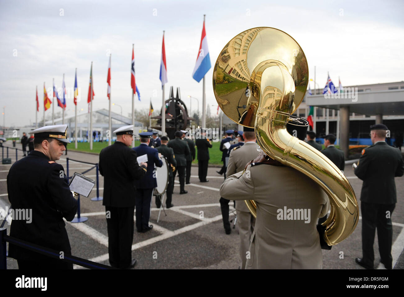 military band of the NATO alliance take part in a flag raising ceremony ...