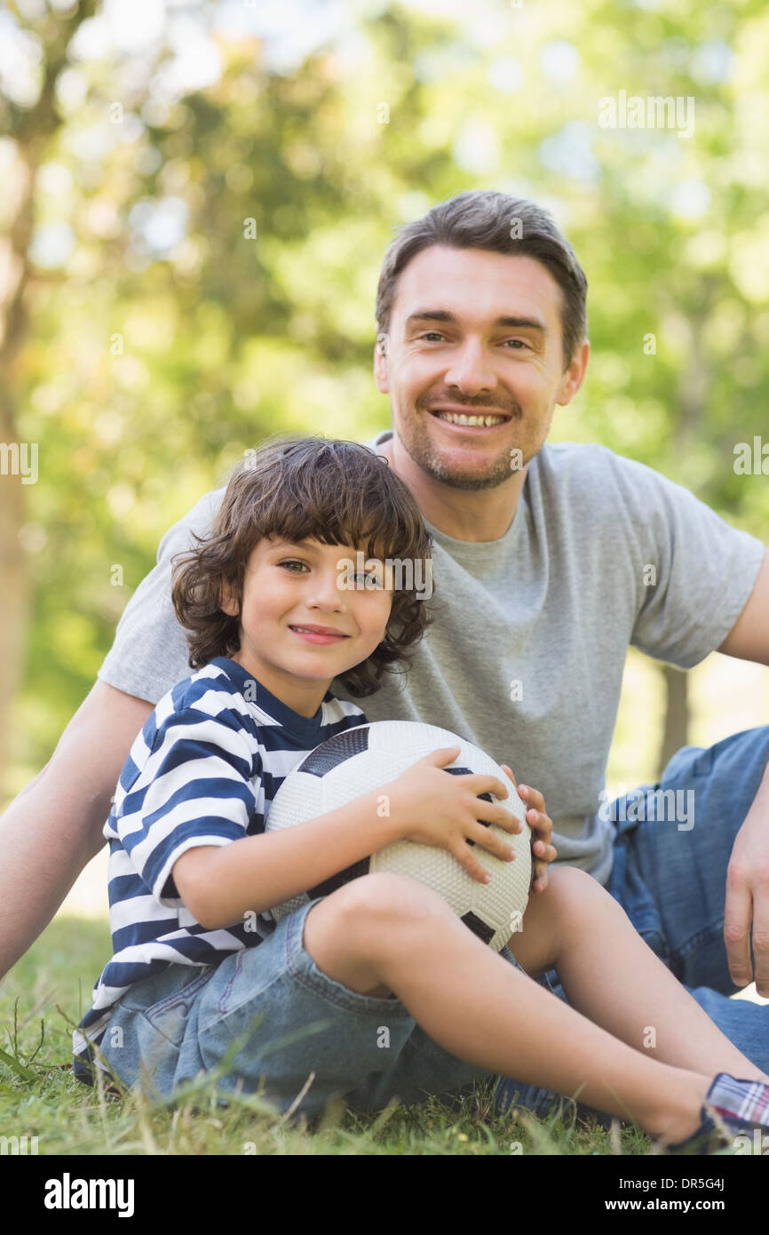 Father teaching son football hi-res stock photography and images - Alamy