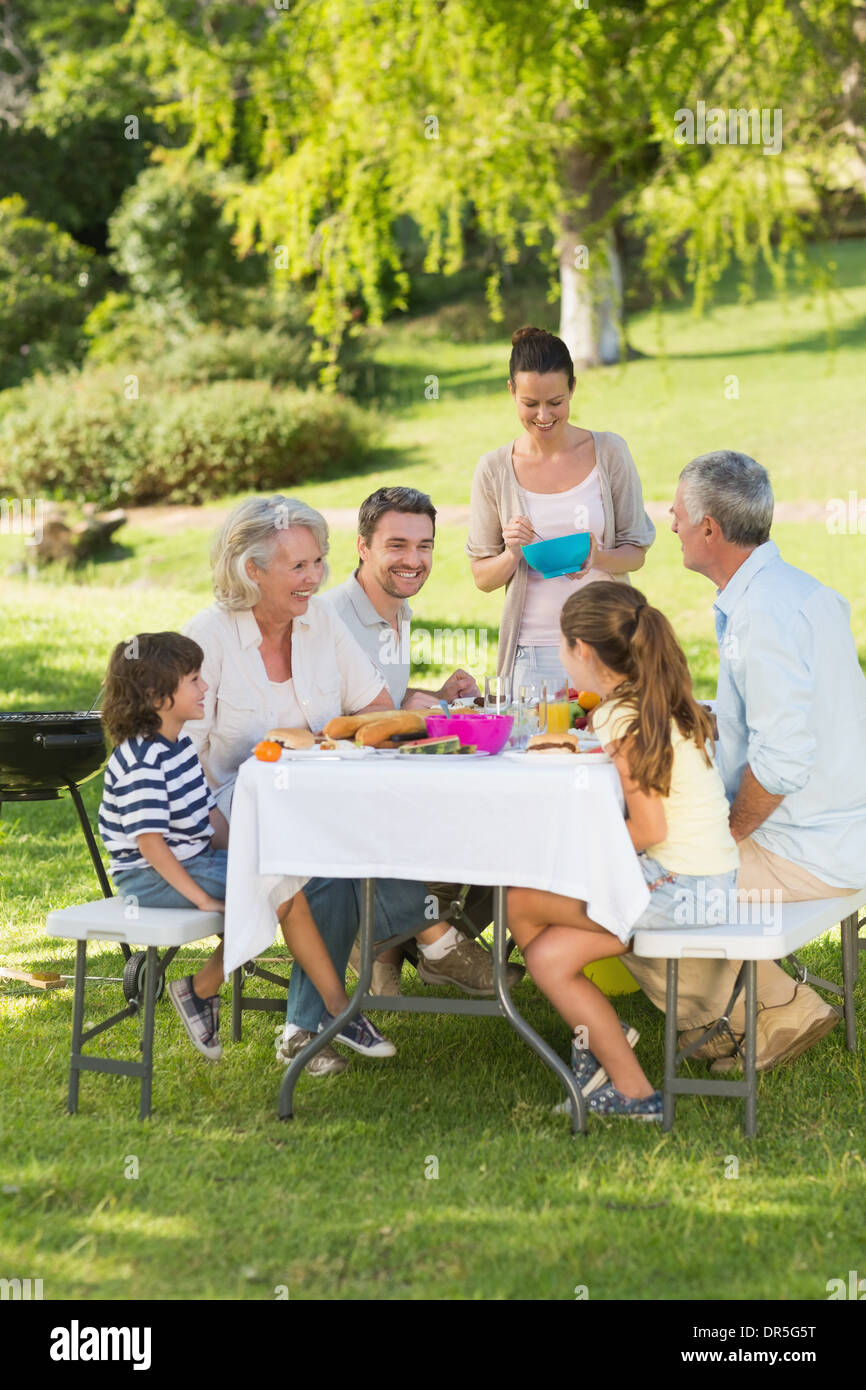 Extended family sitting at dining table in the house Stock Photo - Alamy