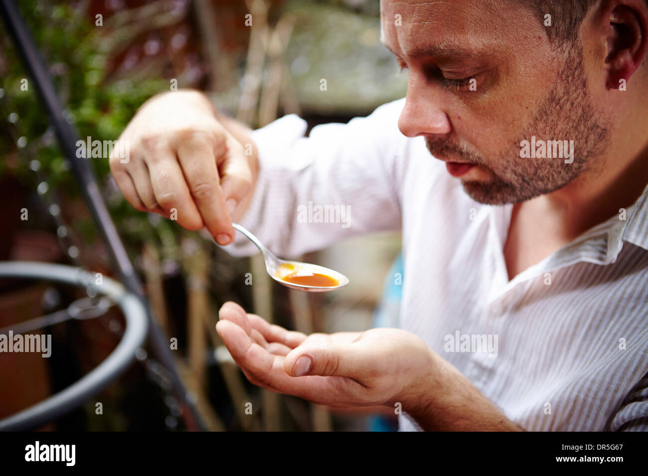 Man Tasting Sauce Stock Photo - Alamy