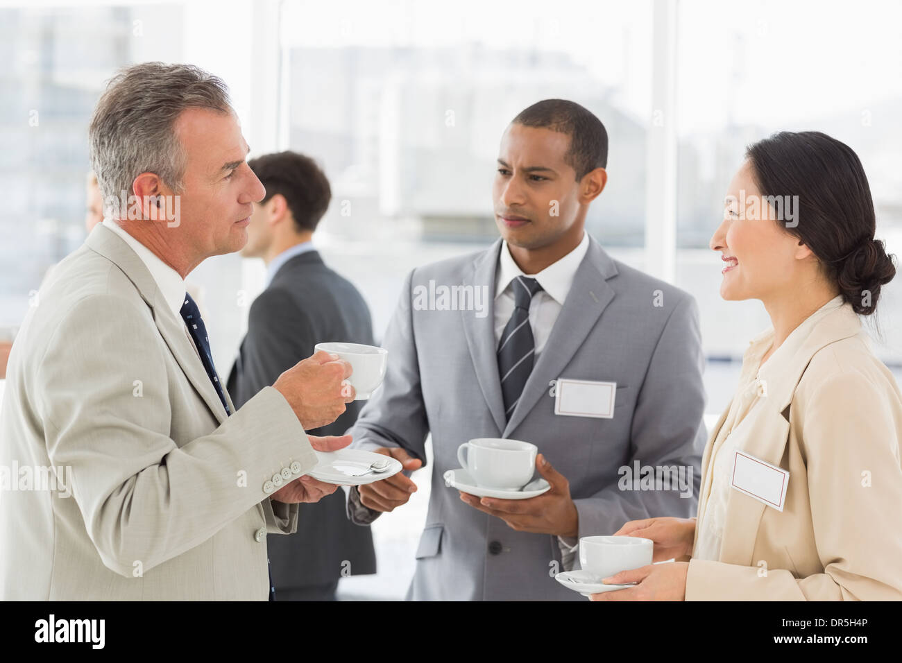 Business people talking and having coffee at a conference Stock Photo ...