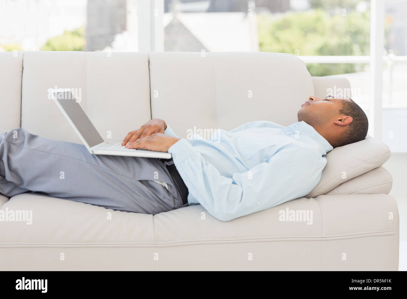 Asleep on the couch hi-res stock photography and images - Alamy