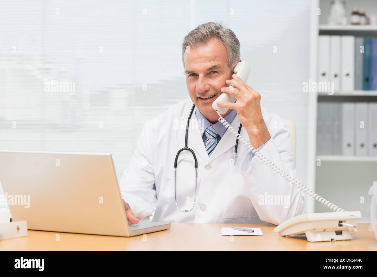Portrait mature man doctor talking hi-res stock photography and images ...
