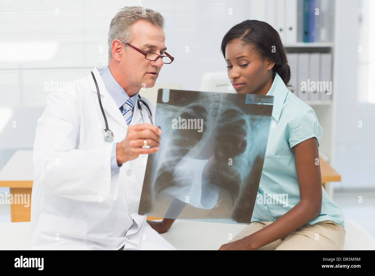 Doctor showing young patient her chest xray Stock Photo - Alamy