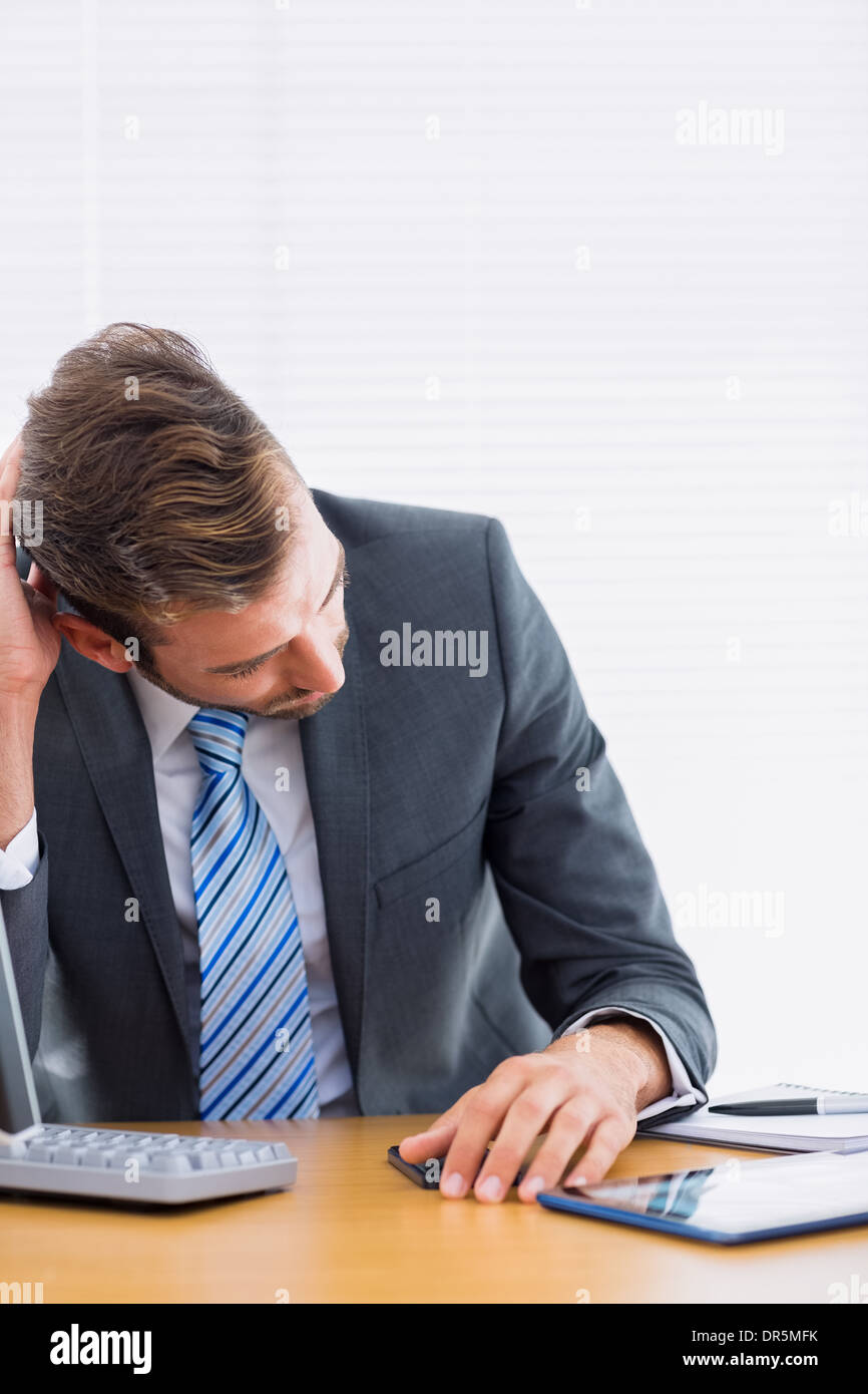 Businessman sitting at desk hi-res stock photography and images - Alamy
