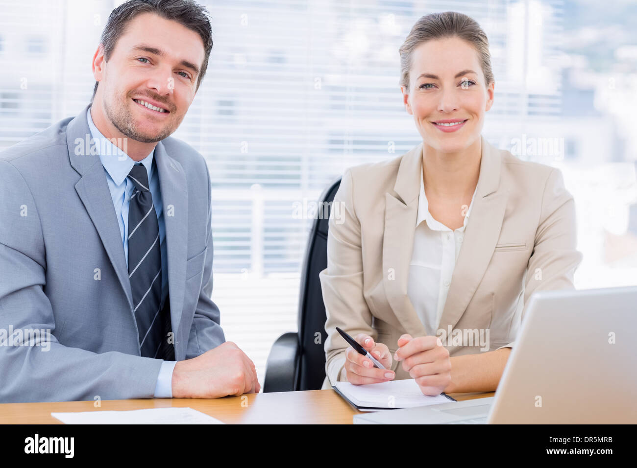 Smartly dressed business man at desk hi-res stock photography and ...