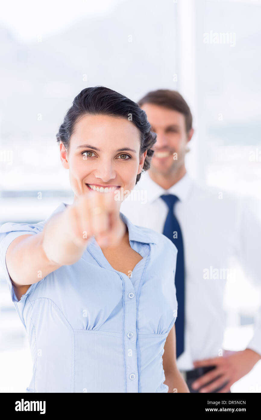 Woman smiling pointing in elegant hi-res stock photography and images ...