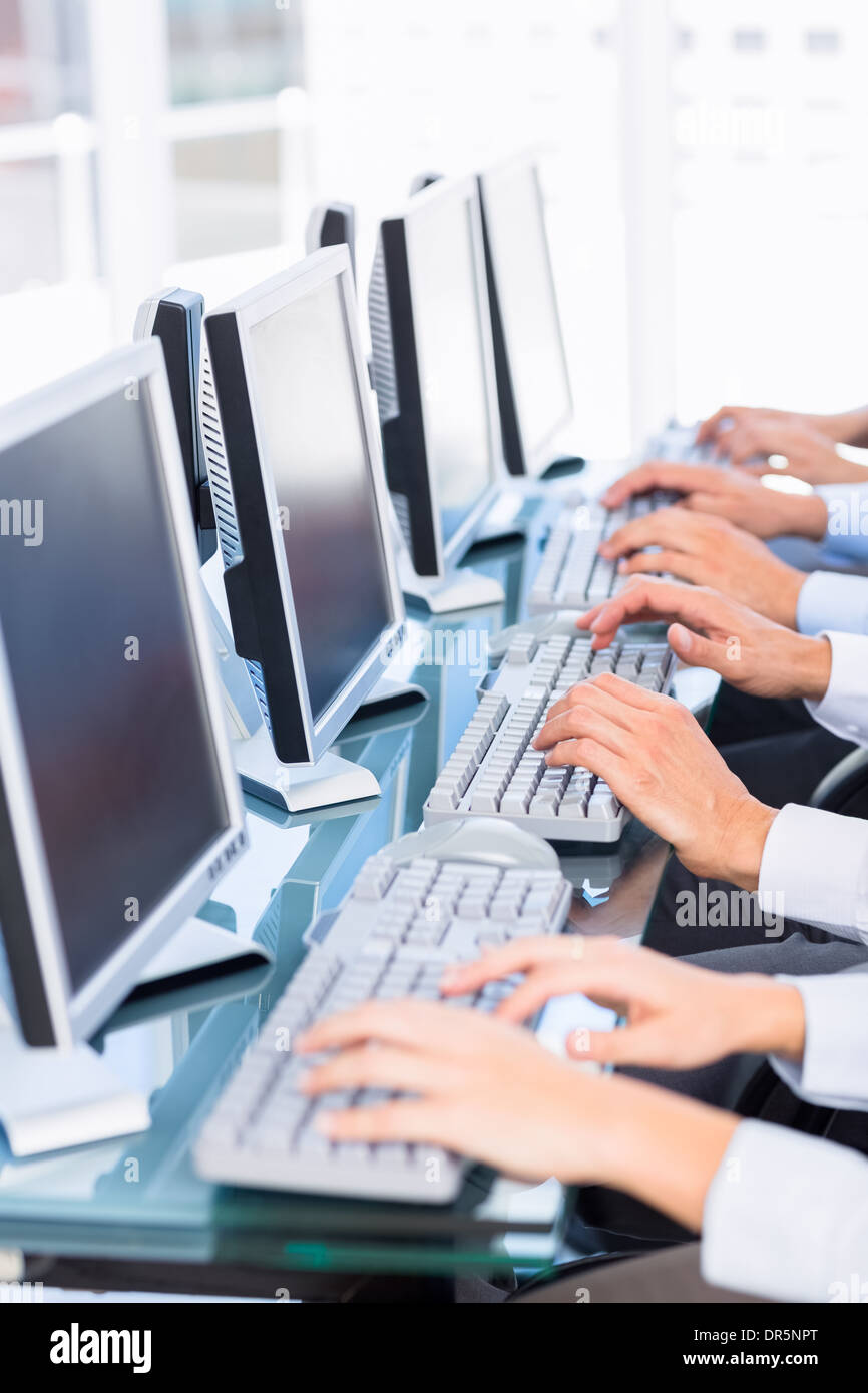 Business colleagues using computers Stock Photo - Alamy
