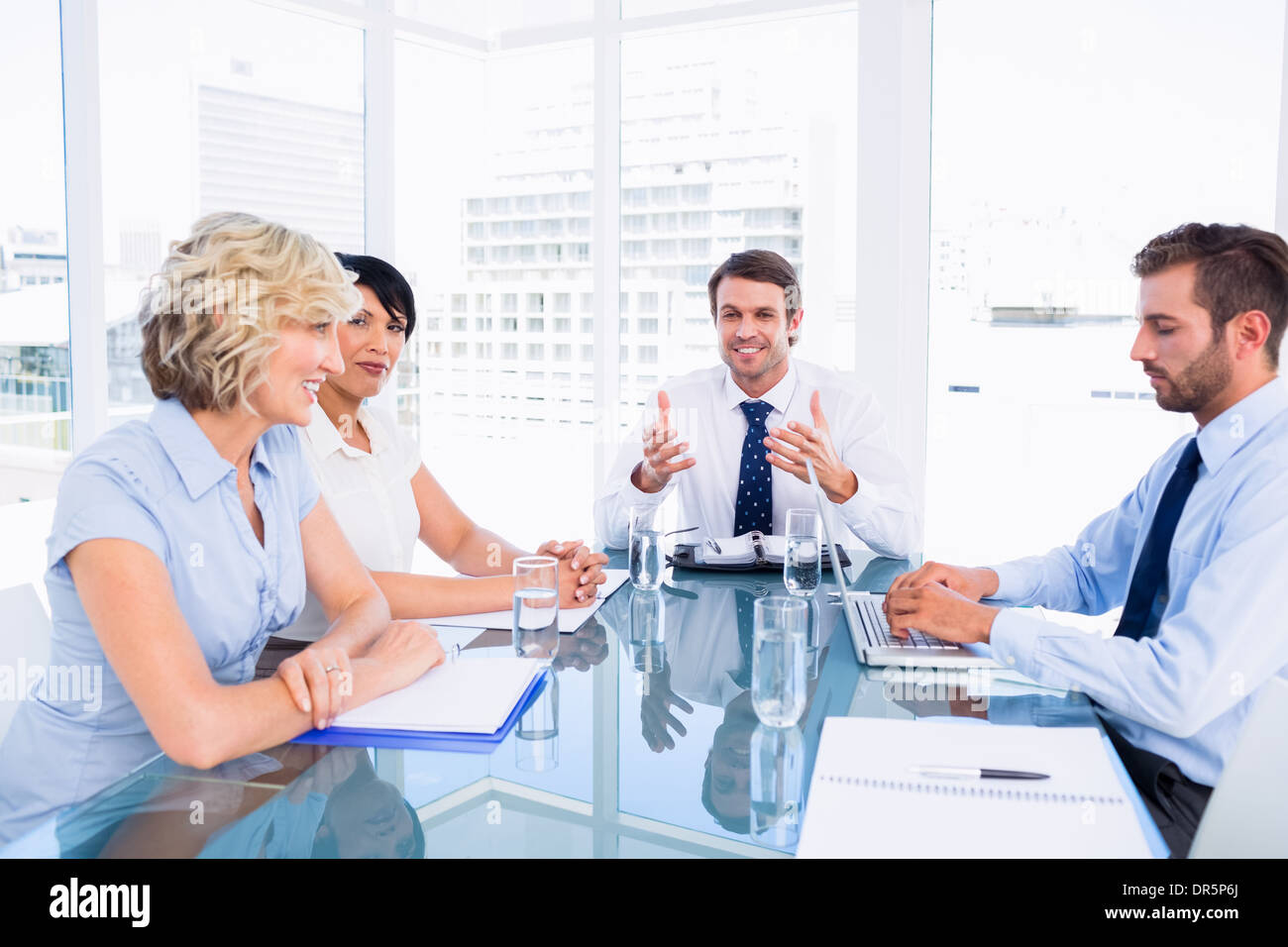 Executives around conference table in office Stock Photo - Alamy