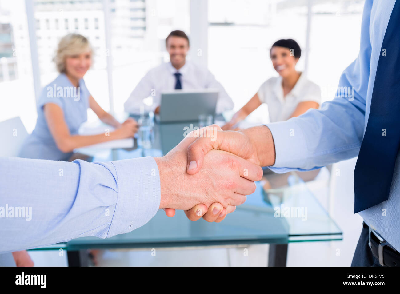 Close-up of a handshake in business meeting Stock Photo - Alamy