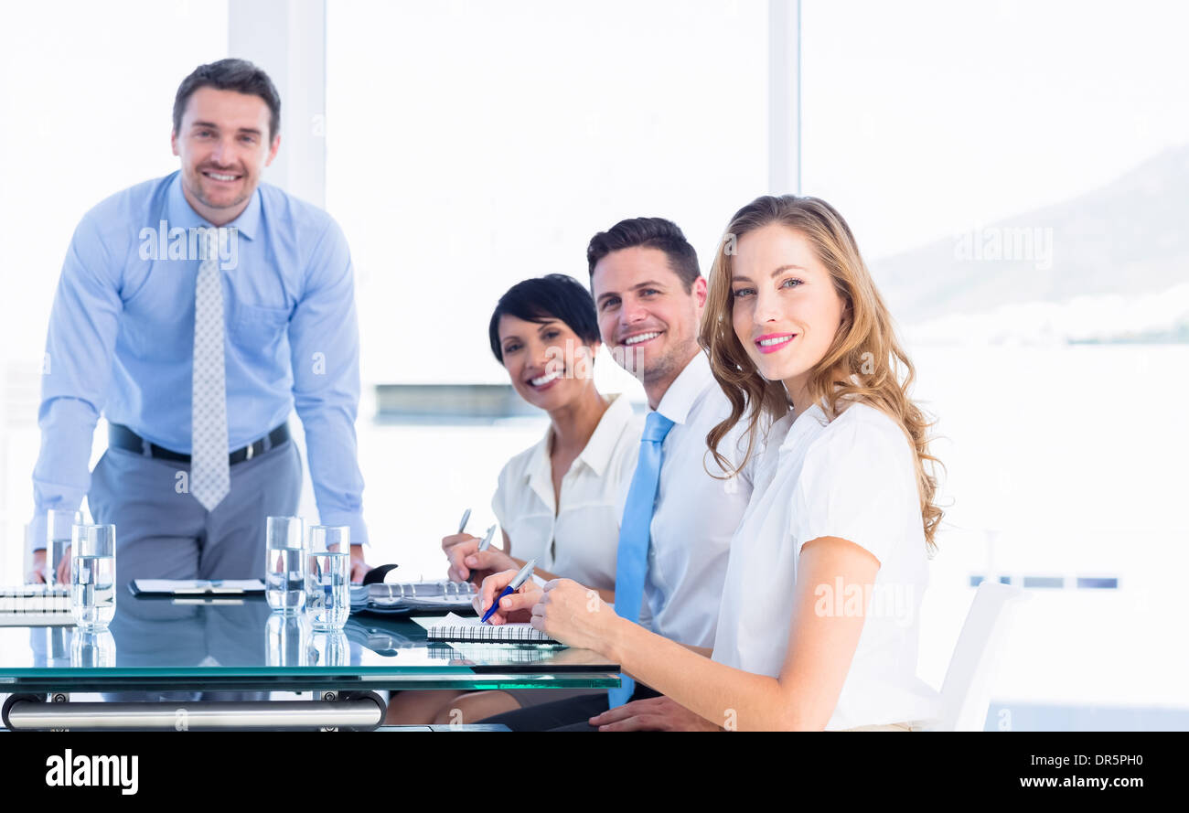 Executives around conference table in office Stock Photo - Alamy