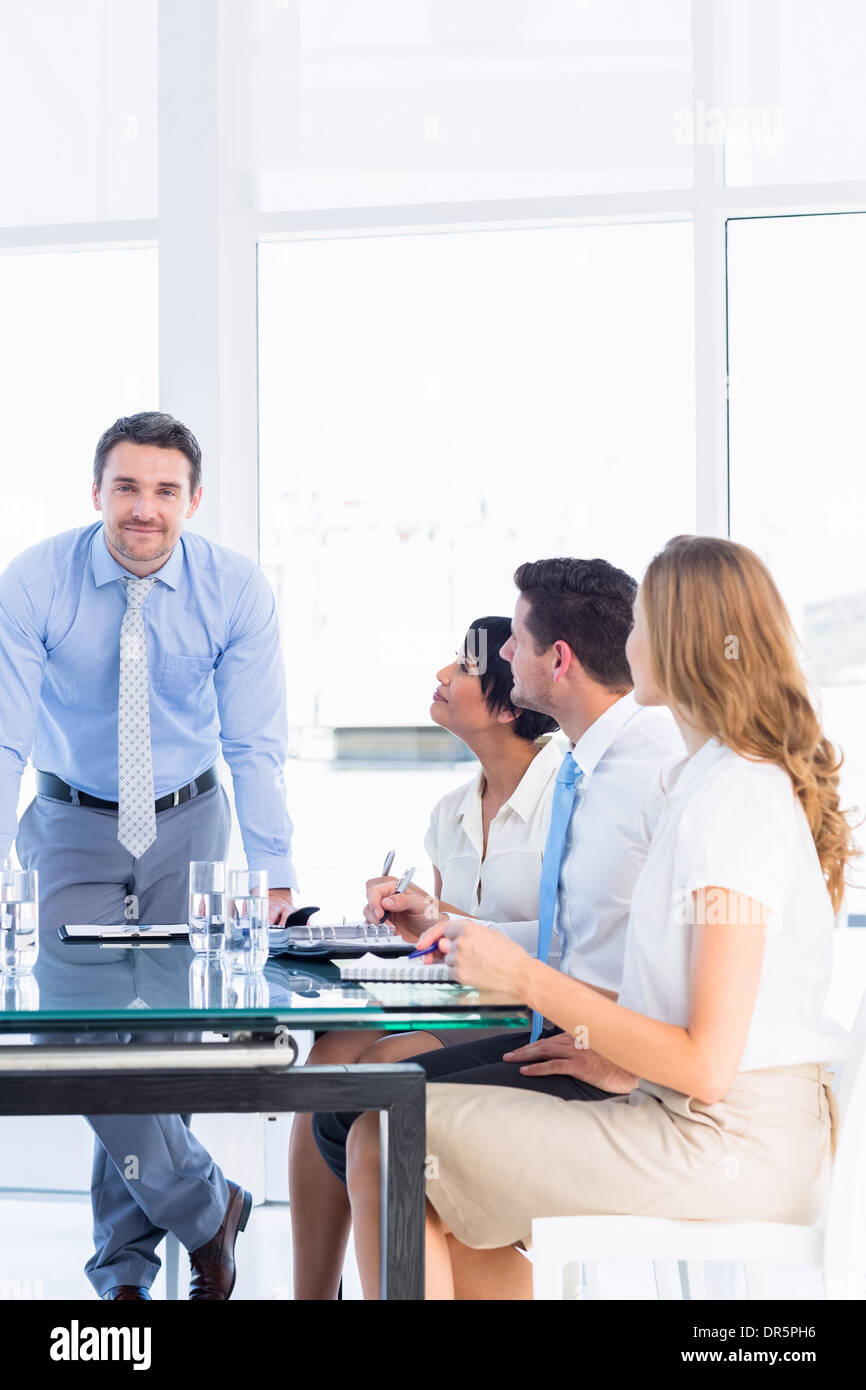 Executives around conference table in office Stock Photo - Alamy
