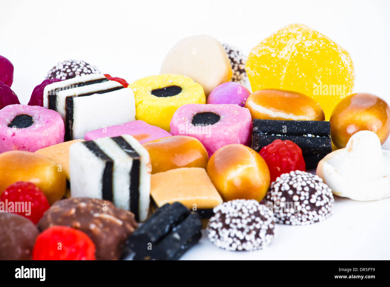 Many candy on white background Stock Photo - Alamy