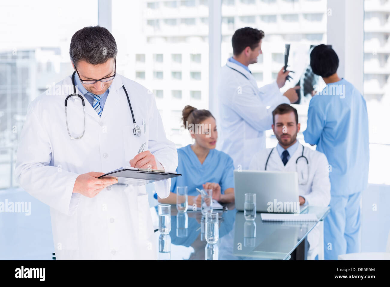 Doctors at work in medical office Stock Photo - Alamy