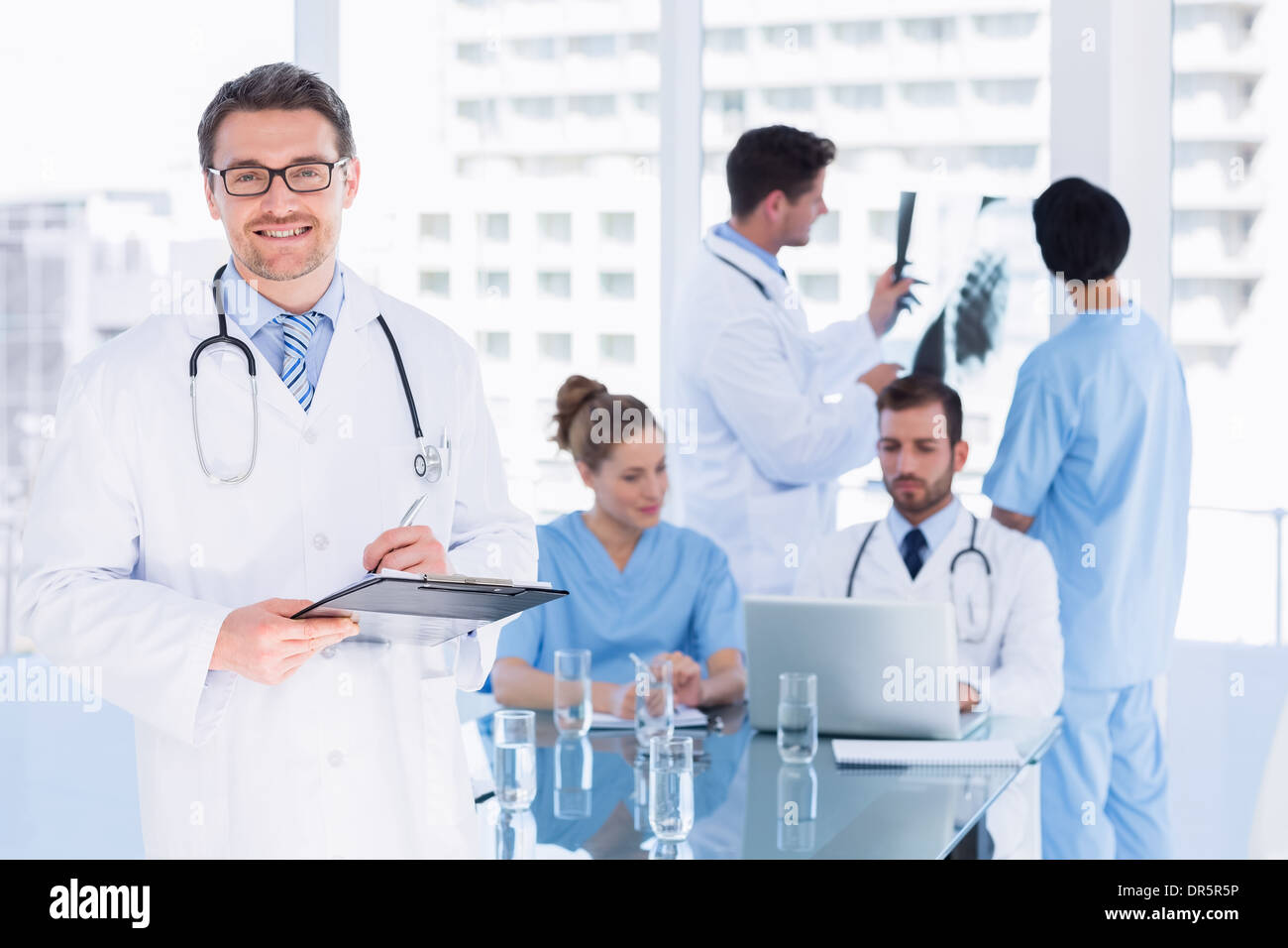 Doctors at work in medical office Stock Photo - Alamy