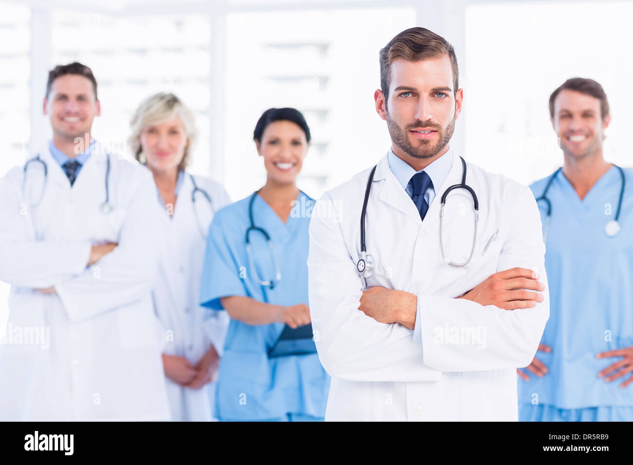 Confident happy group of doctors at medical office Stock Photo - Alamy