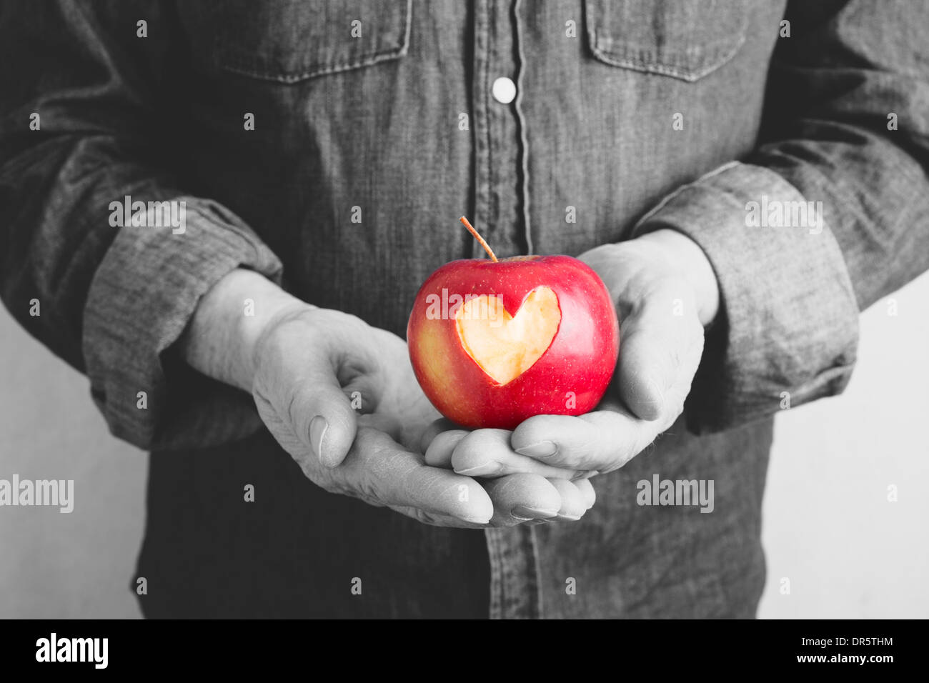 red apple with hands of man Stock Photo - Alamy