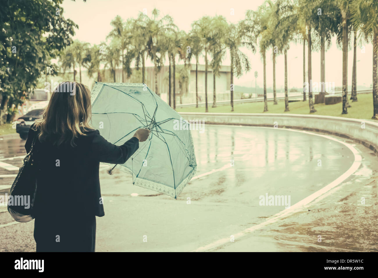 Woman getting wet in rain hi-res stock photography and images - Alamy