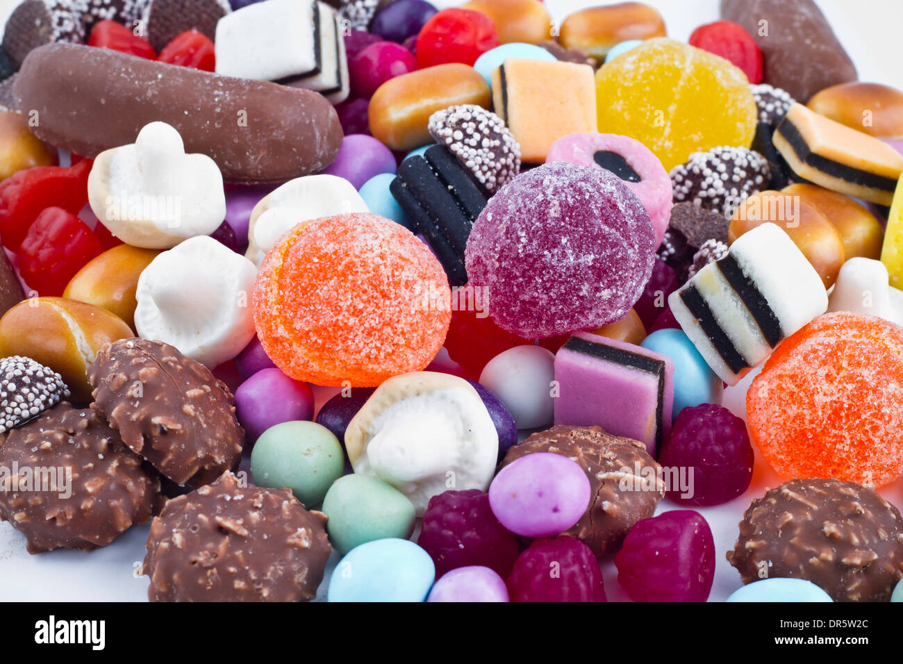 Many candy on white background Stock Photo - Alamy