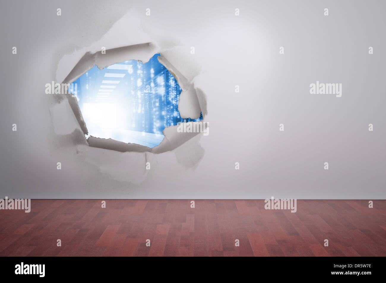 Rip on wall showing server hallway Stock Photo - Alamy