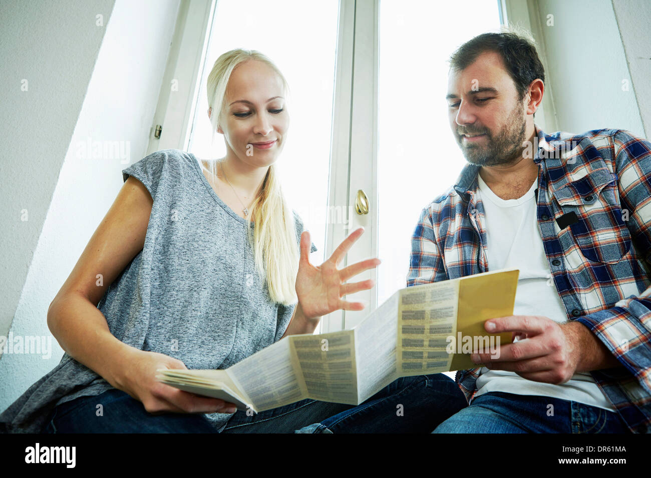 Couple looking at color samples, Munich, Bavaria, Germany Stock Photo ...