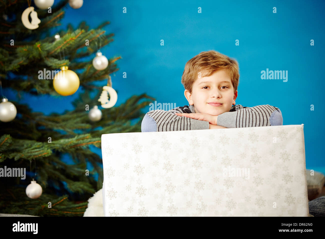 Wrapped christmas boy hi-res stock photography and images - Alamy