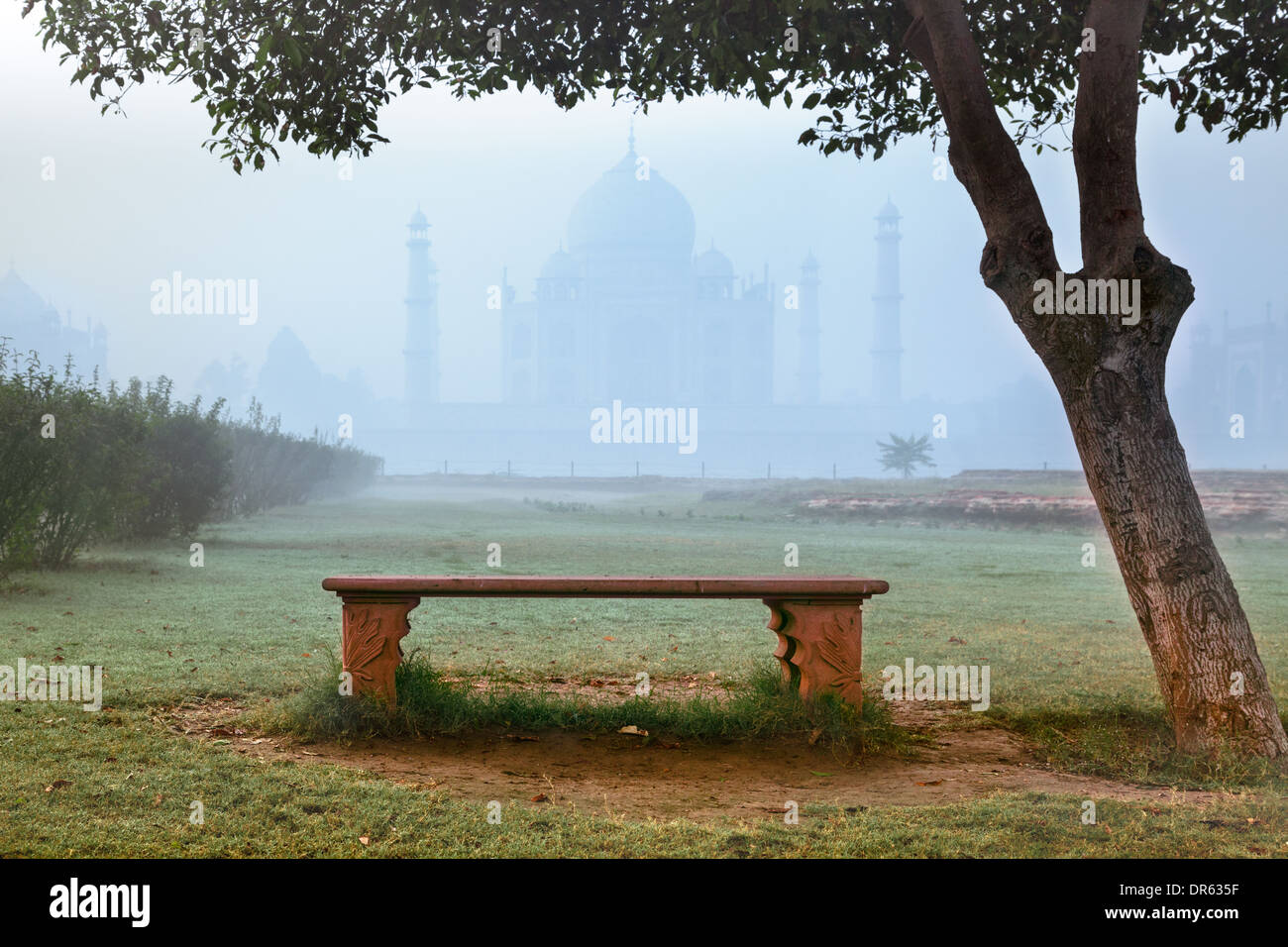 Empty bench by Taj Mahal hidden in morning fog Stock Photo - Alamy