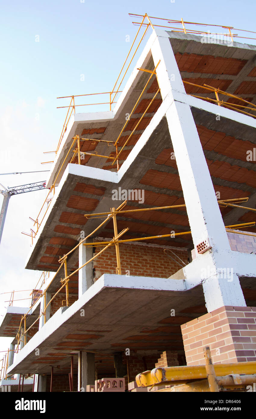 Buildings under construction at sunset Stock Photo - Alamy