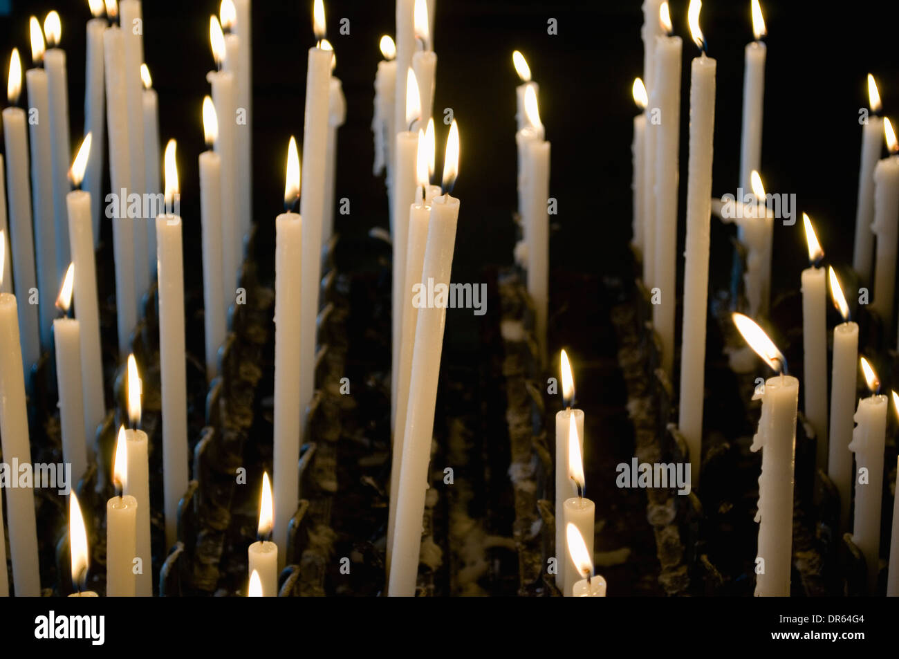 Cluster of candles in church Stock Photo - Alamy