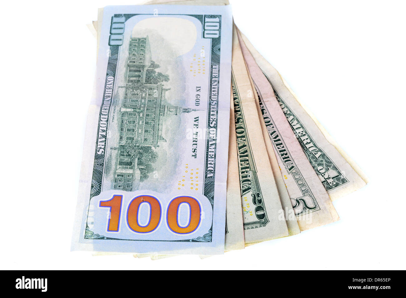 Several dollar bills of different denominations isolated on white Stock ...