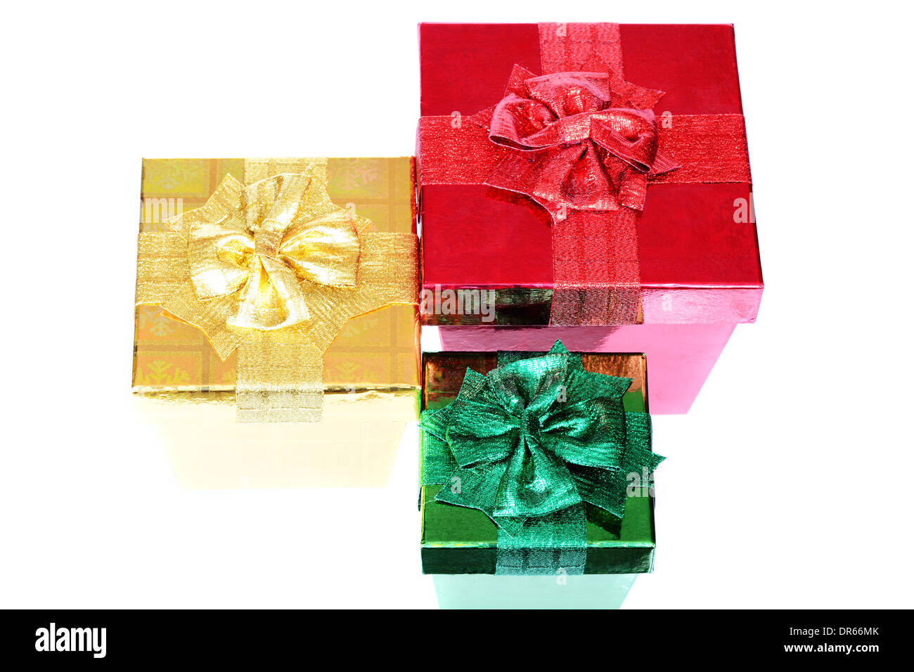Three gift boxes of different size and color isolated on white Stock ...
