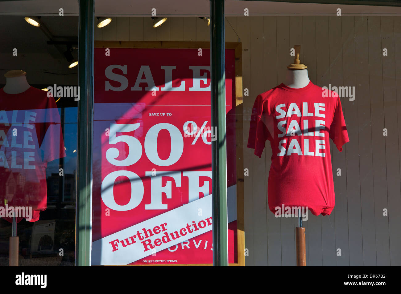 Sale signs in shop window, , UK Stock Photo - Alamy