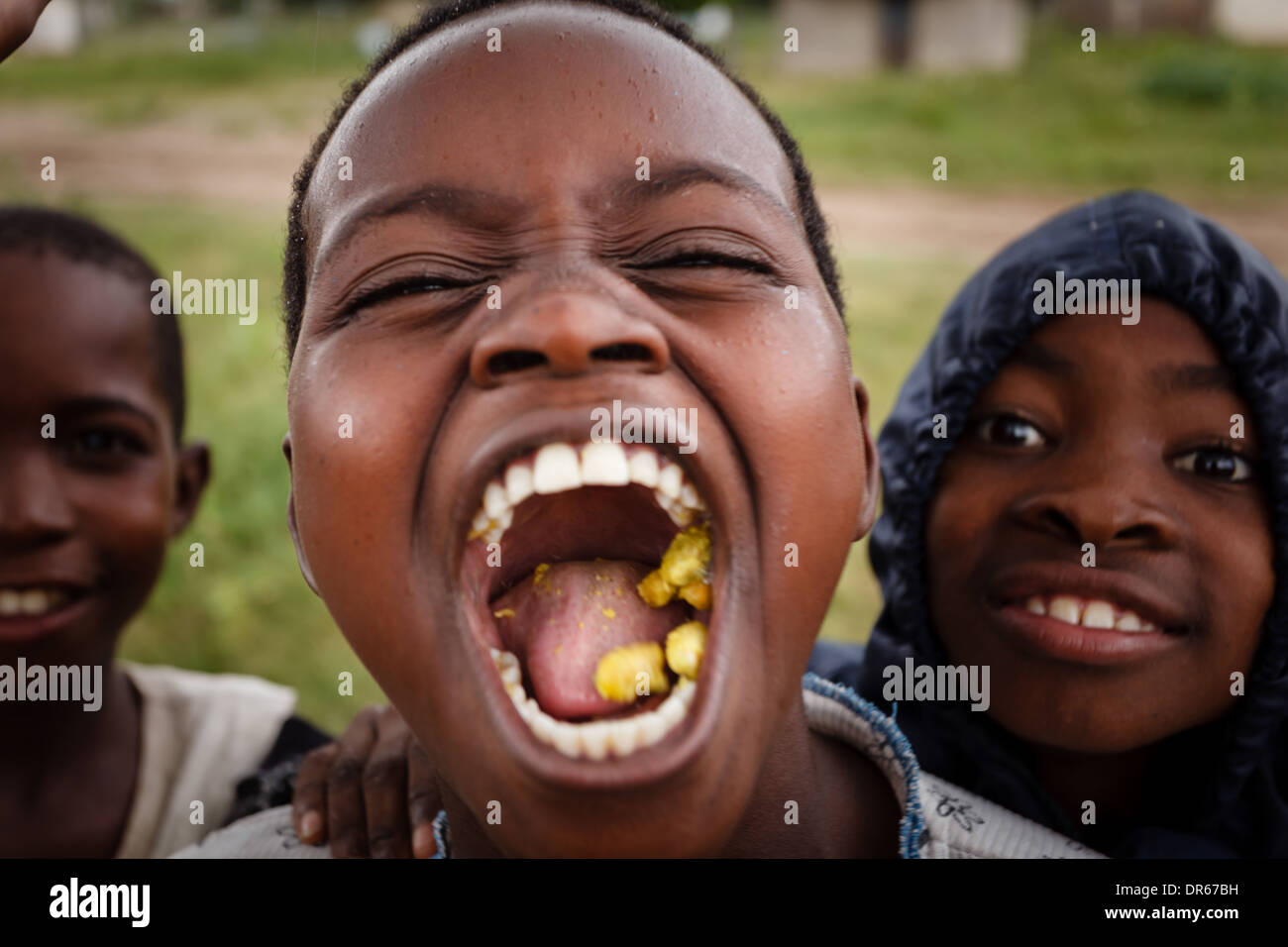 Portrait of face of 3 young native boys in Okavango Panhandle, Botswana ...