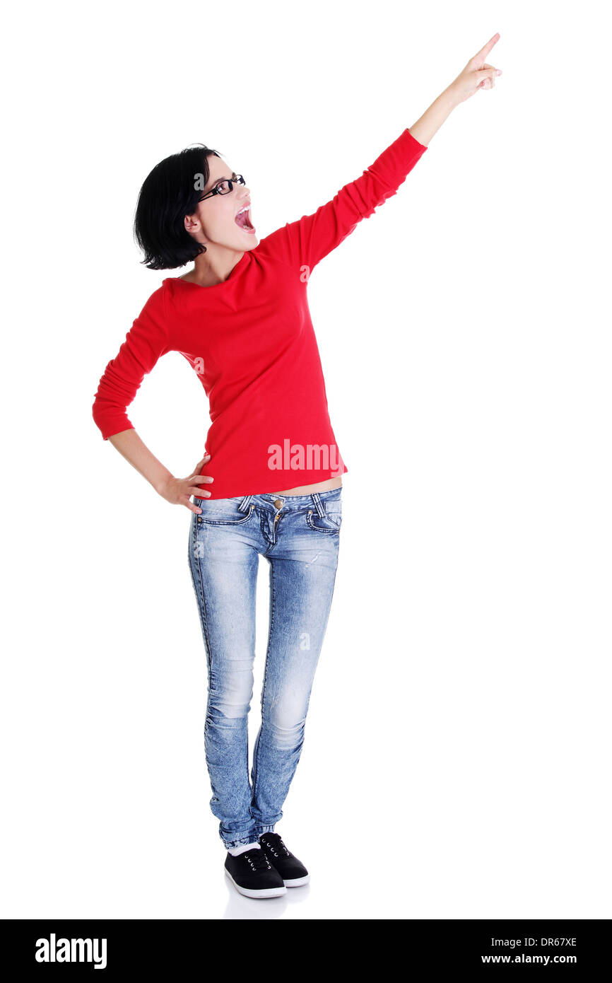 Happy , excited young woman pointing on copy space, isolated on white ...
