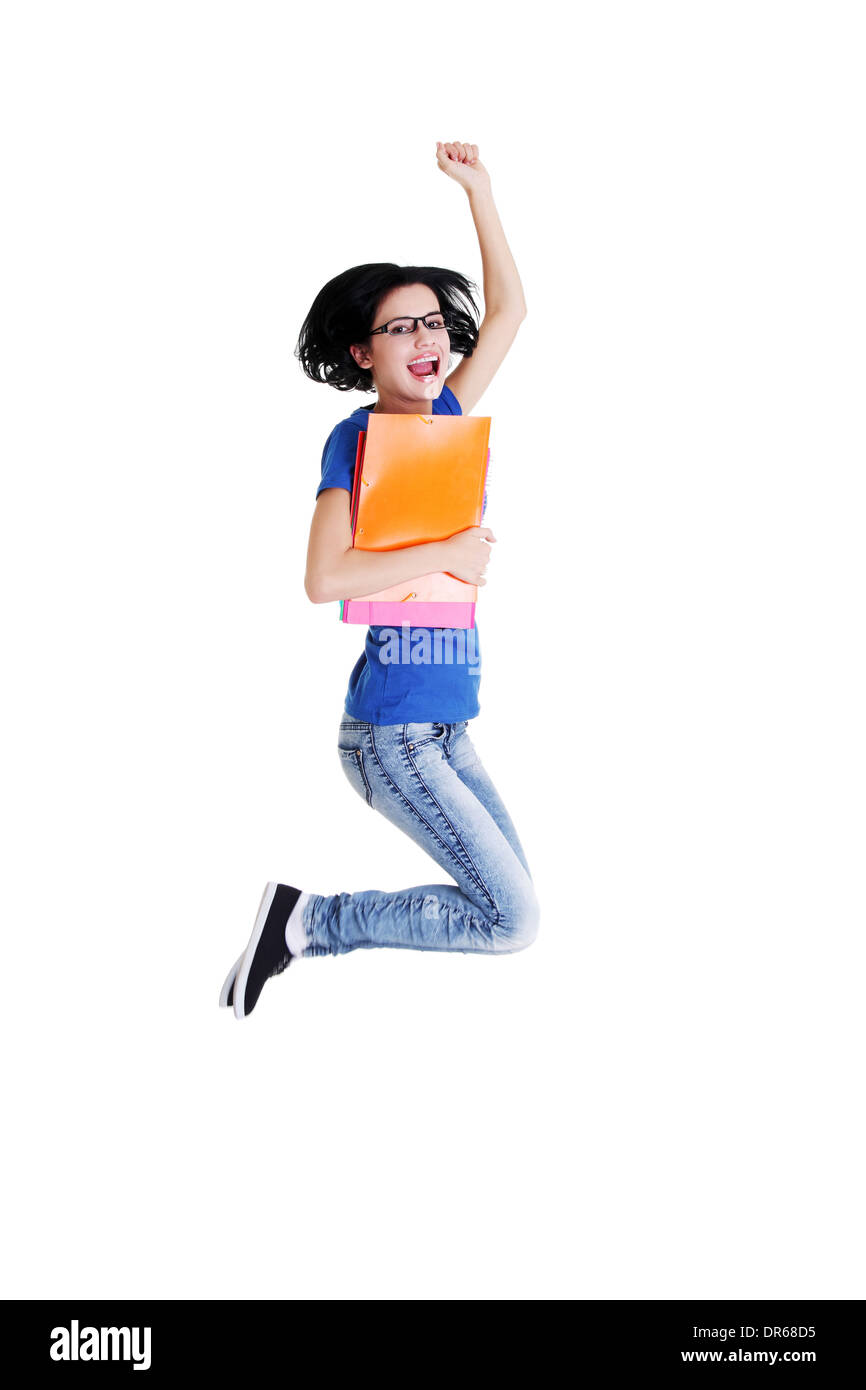 Happy female student jumping with a notebook isolated Stock Photo - Alamy