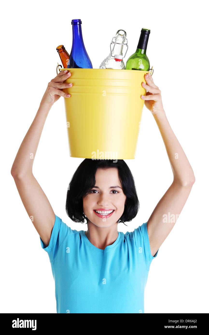 Beautiful young woman holding recycling bin isolated on white ...