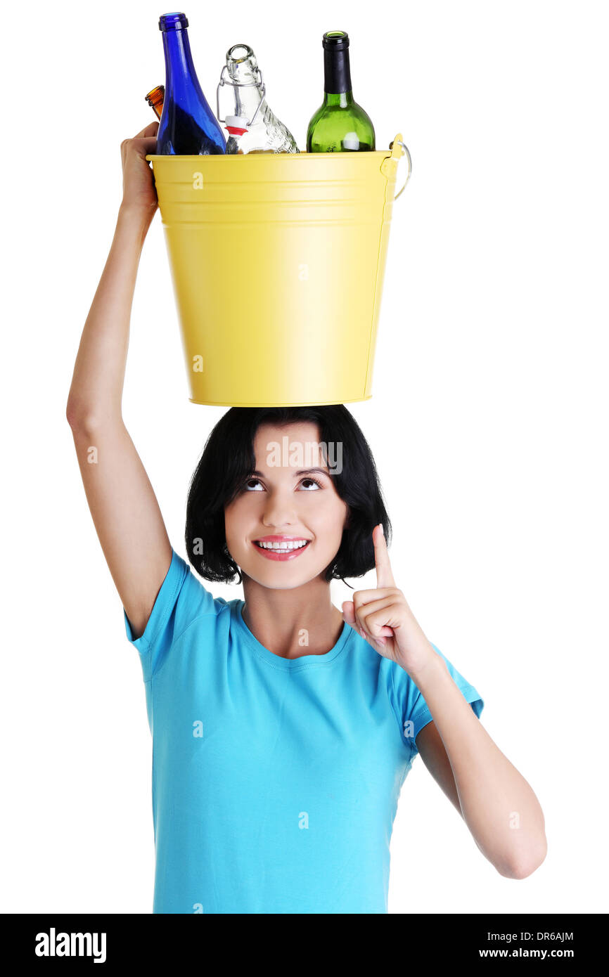 Beautiful young woman holding recycling bin isolated on white ...