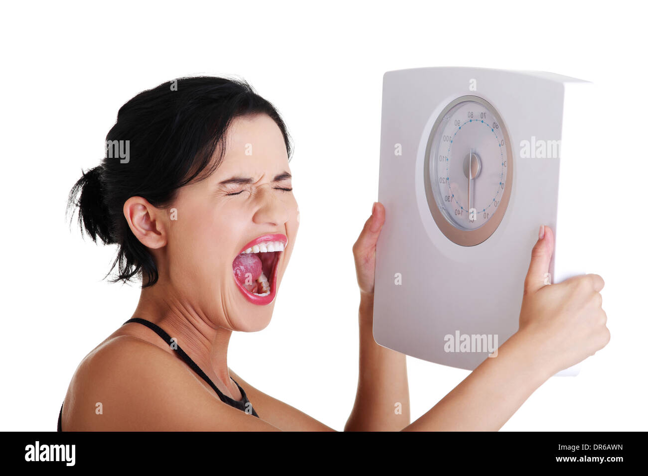 Frustrated woman with scale, isolated on white Stock Photo - Alamy