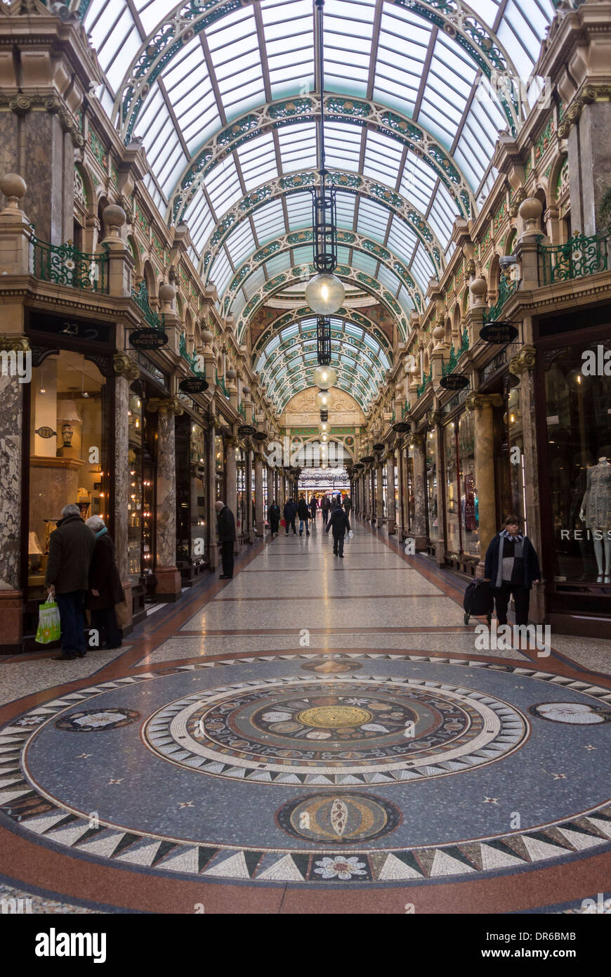 Ornate cast-iron segmental-arched roof trusses and mosaiced floor of ...