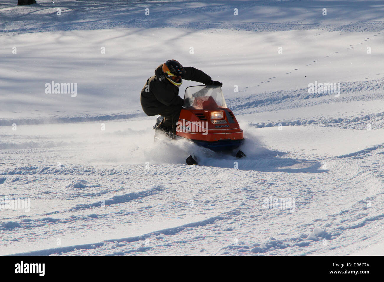 A man rides a snowmobile in Northern Quebec Stock Photo - Alamy