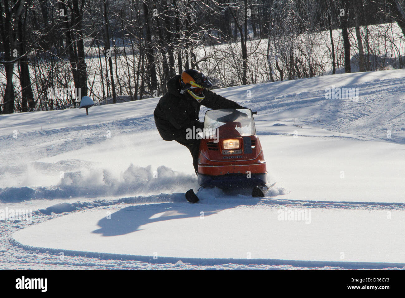 A man rides a snowmobile in Northern Quebec Stock Photo - Alamy