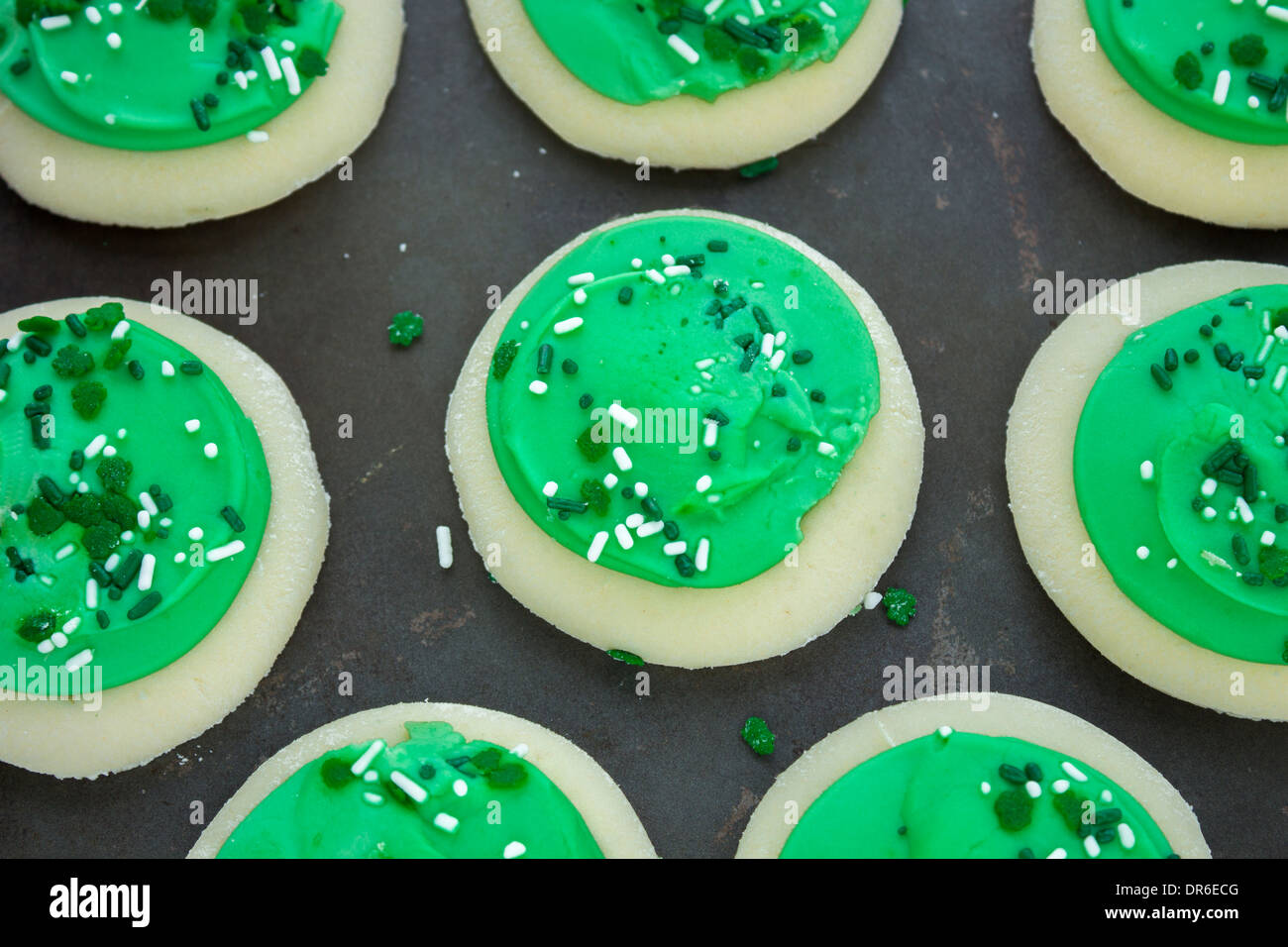 Green frosted sugar cookies with shamrock sprinkles Stock Photo - Alamy
