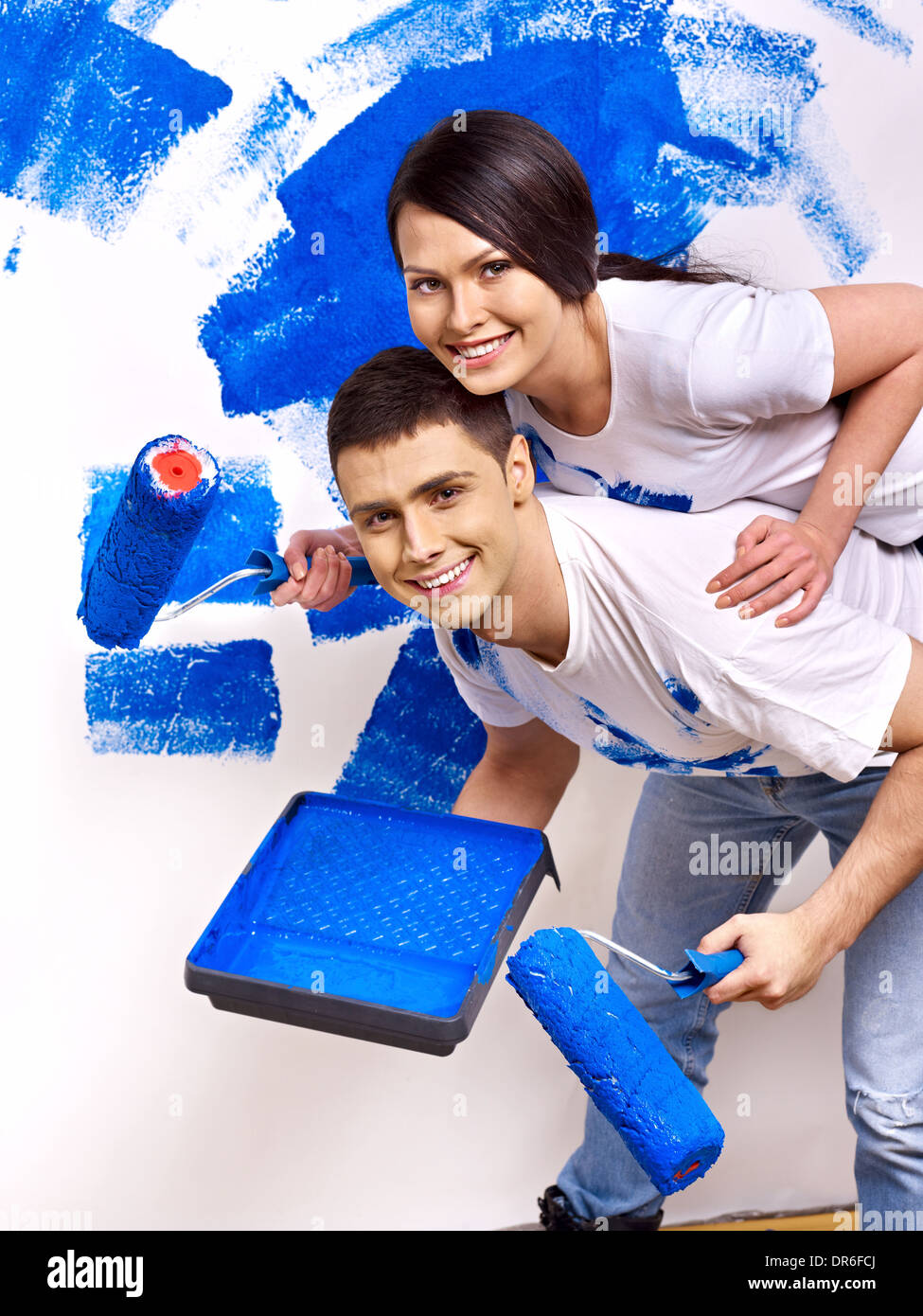 Happy family paint wall at home Stock Photo - Alamy